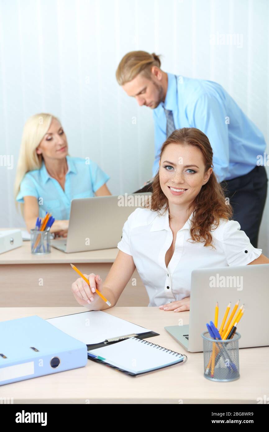 Office workers in workplace Stock Photo - Alamy