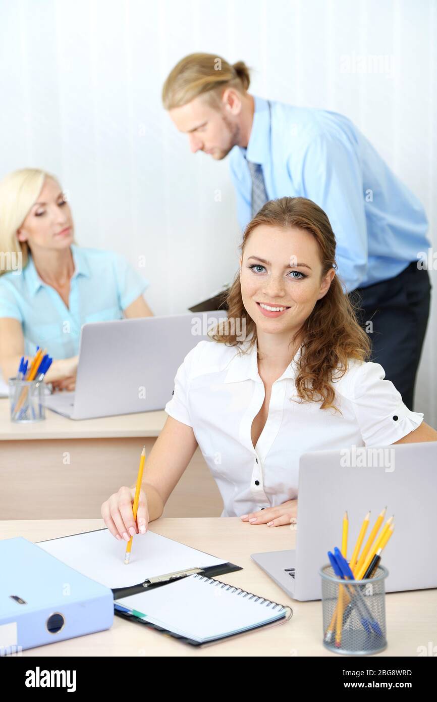 Office workers in workplace Stock Photo - Alamy