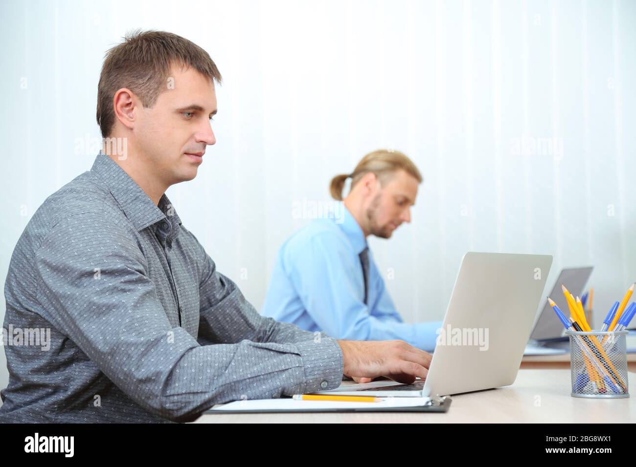 Office staff is during work in workplace Stock Photo - Alamy