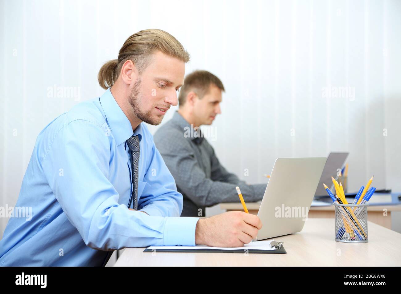 Office staff is during work in workplace Stock Photo - Alamy