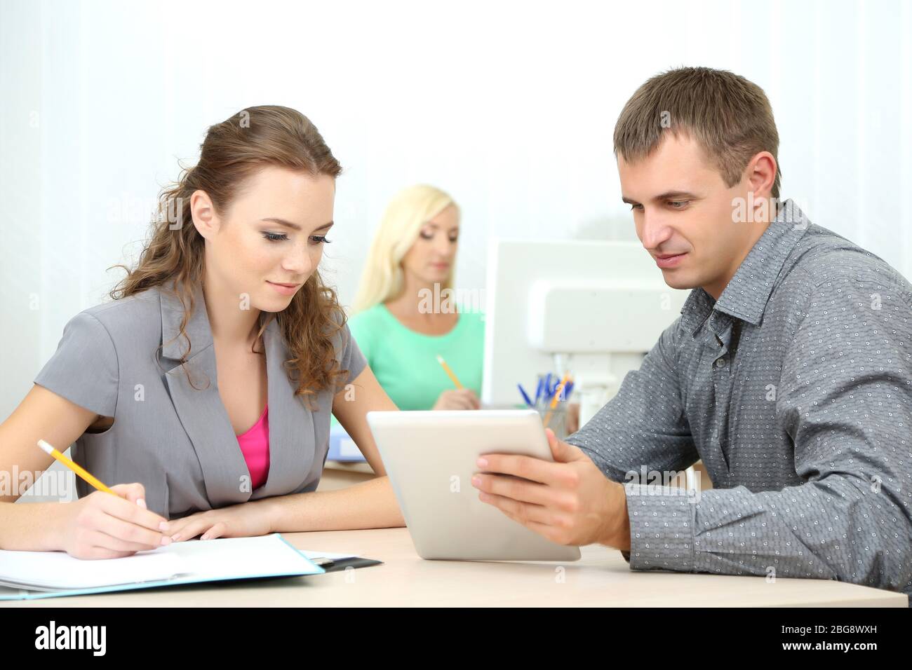Office workers at work Stock Photo - Alamy