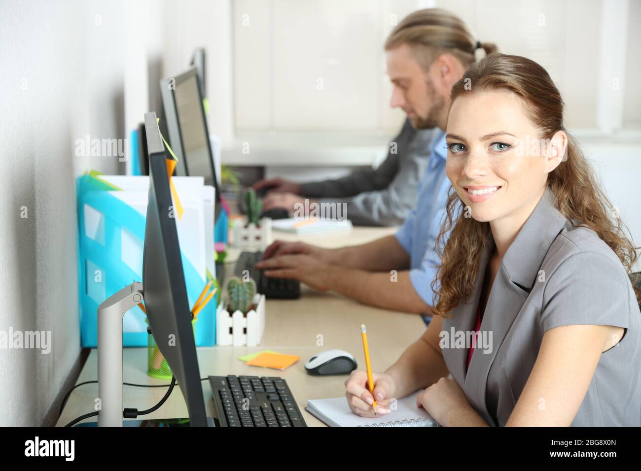 Business people at work place Stock Photo - Alamy
