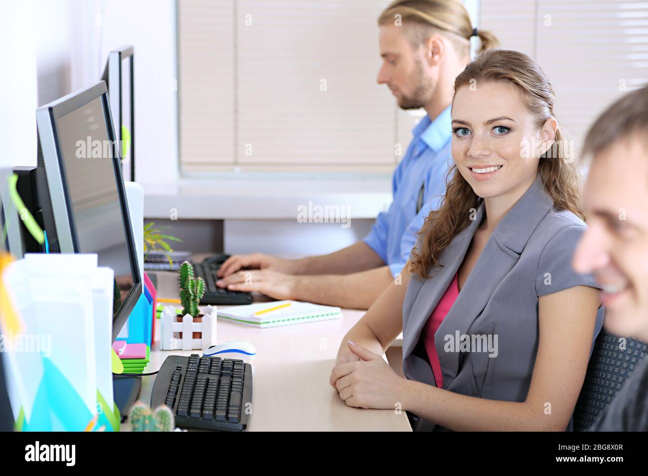 Business people at work place Stock Photo - Alamy