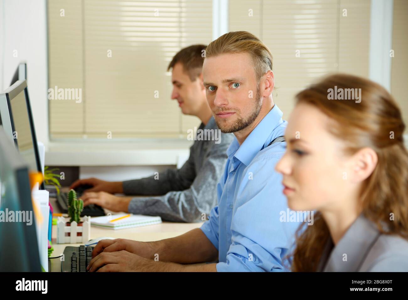 Business people at work place Stock Photo - Alamy