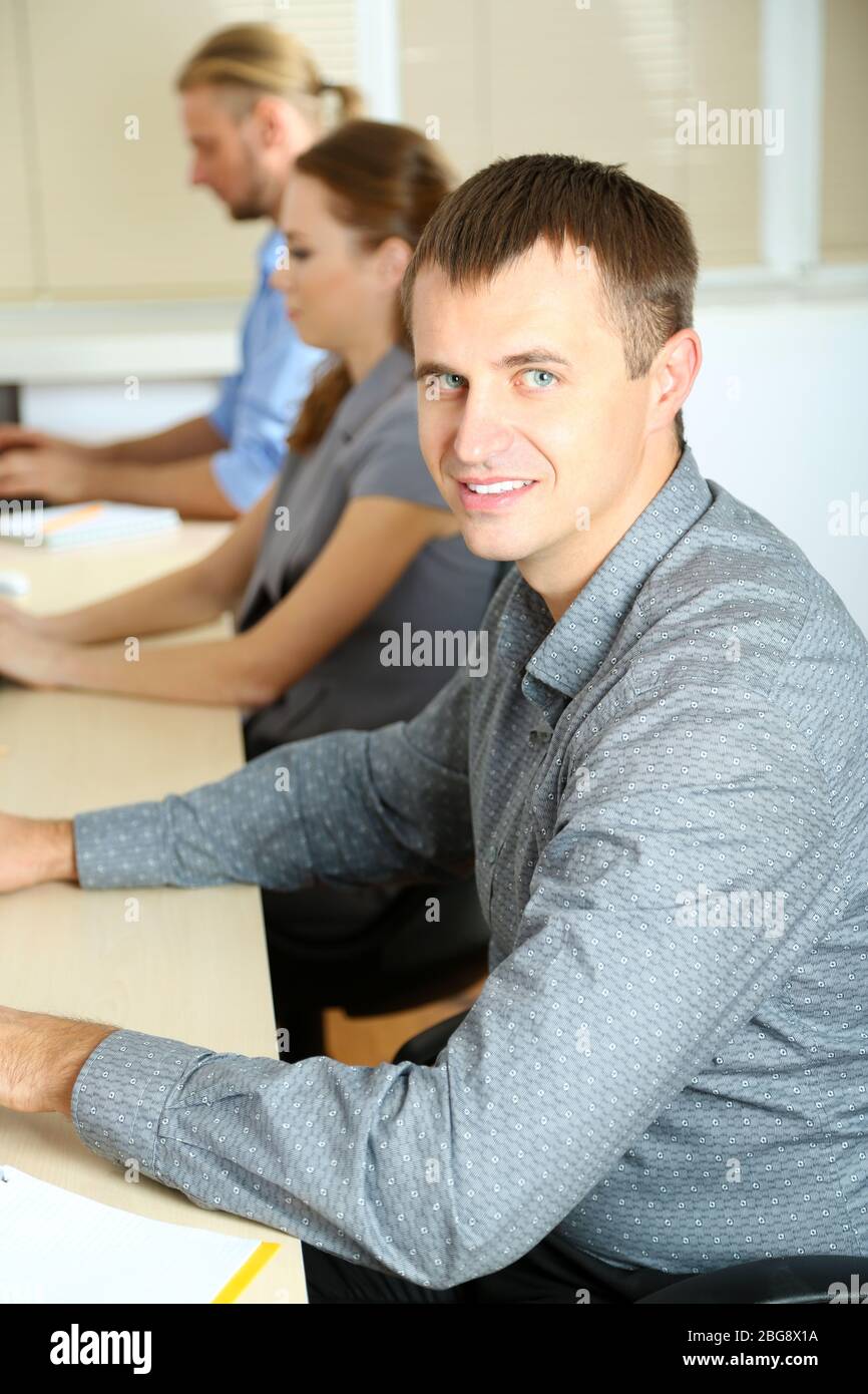 Business people at work place Stock Photo - Alamy
