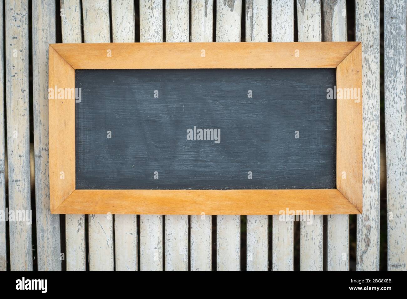 Empty chalk board on bamboo background. Blank blackboard with wooden ...