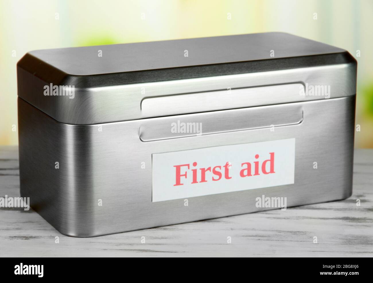 First aid box on bright background Stock Photo - Alamy