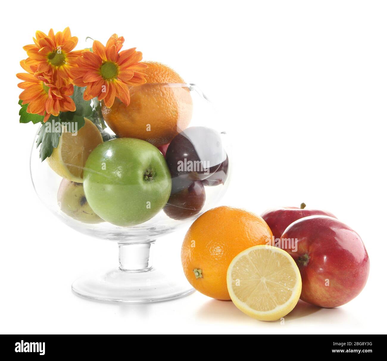 Composition of different fruits with glass vase and flowers isolated on ...