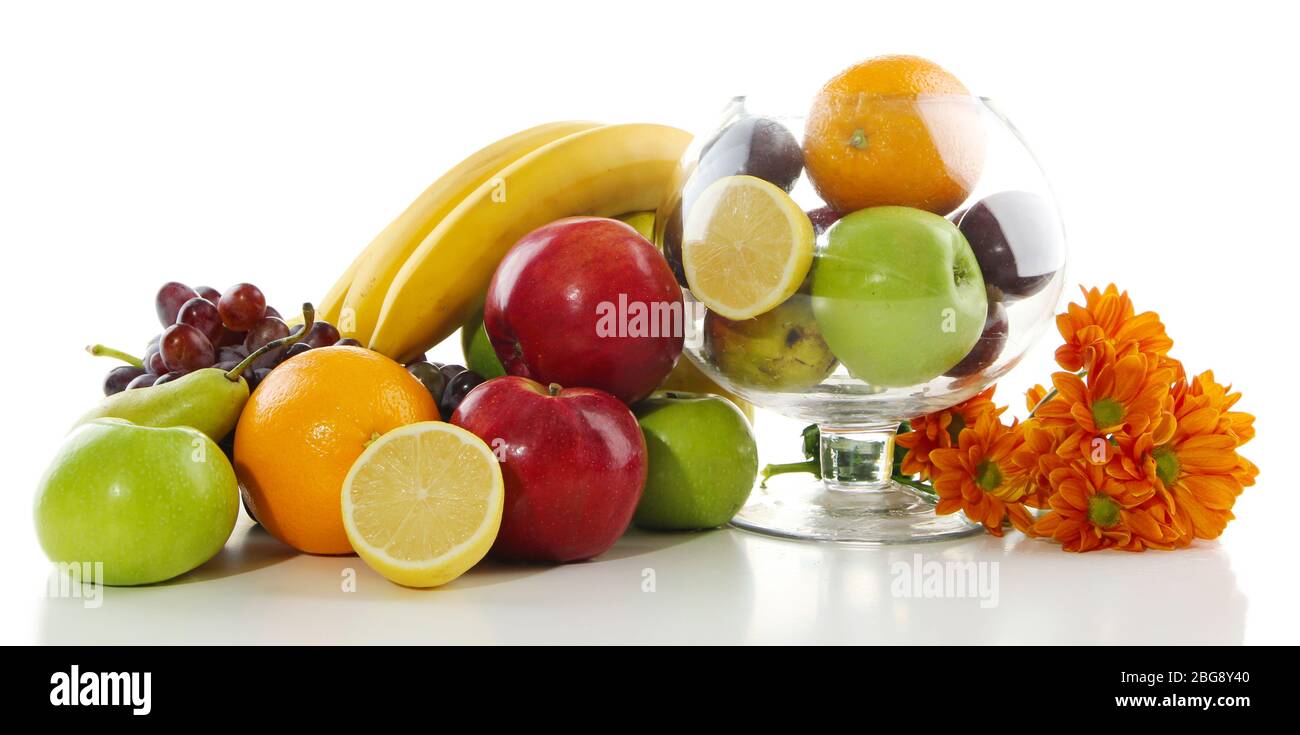 Composition of different fruits with glass vase and flowers isolated on ...