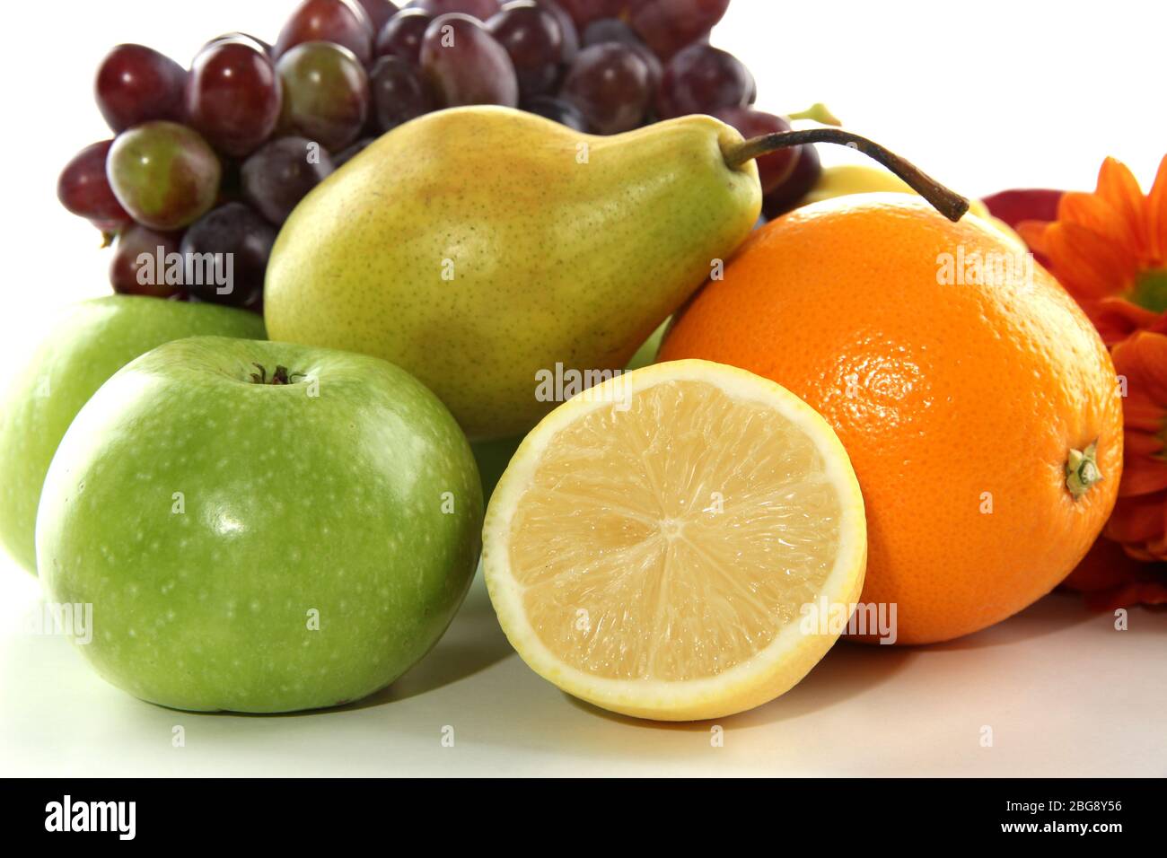 Composition of different fruits with flowers isolated on white Stock ...