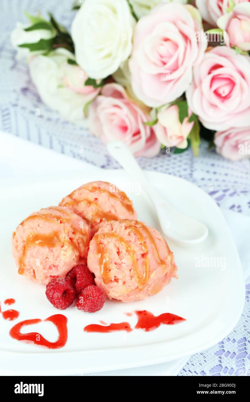 Delicious ice cream on plate on table close-up Stock Photo - Alamy