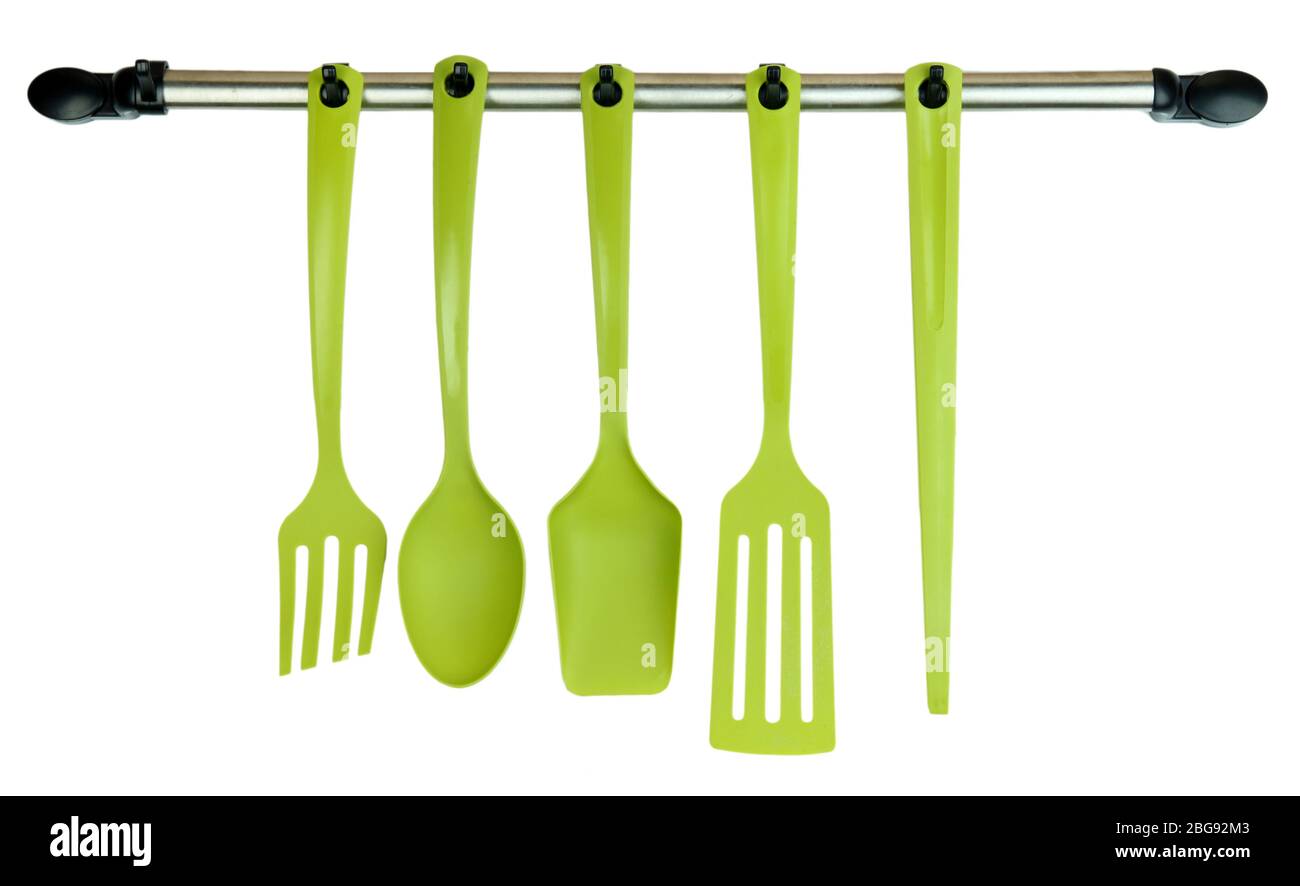 Plastic kitchen utensils on silver hooks isolated on white Stock Photo ...