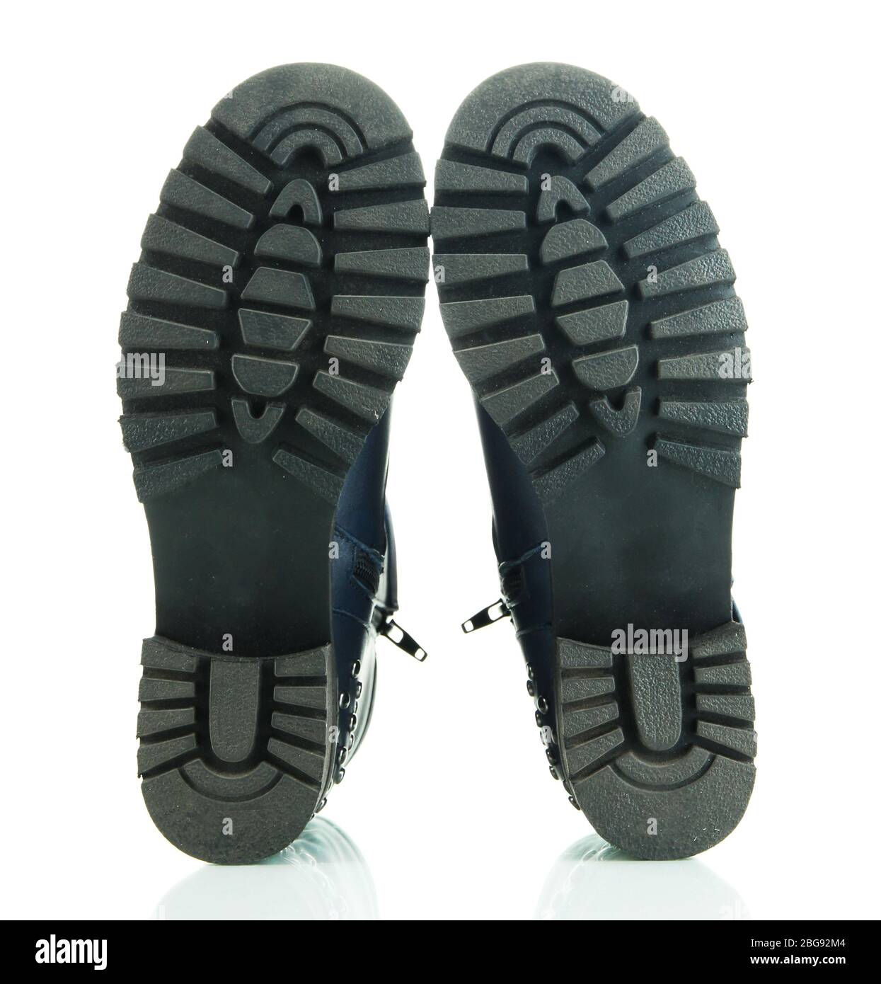 Soles of boots isolated on white Stock Photo - Alamy