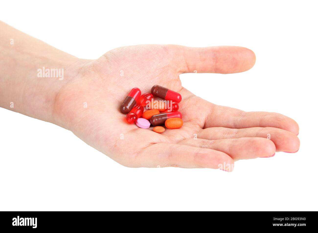 Pills in hand isolated on white Stock Photo - Alamy