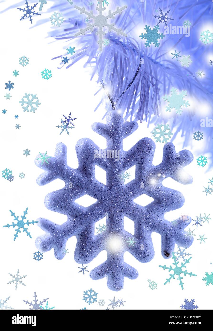 Christmas snowflake on snow-white Christmas tree close-up isolated on ...