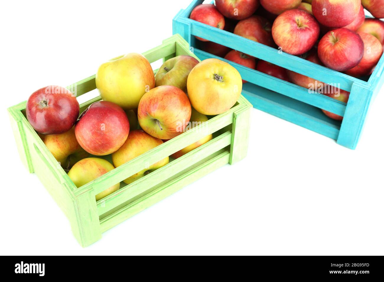 Juicy apples in wooden boxes isolated on white Stock Photo - Alamy