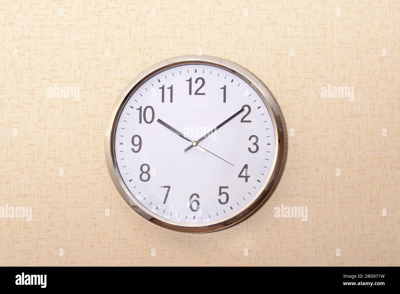 Clock on wall background Stock Photo - Alamy