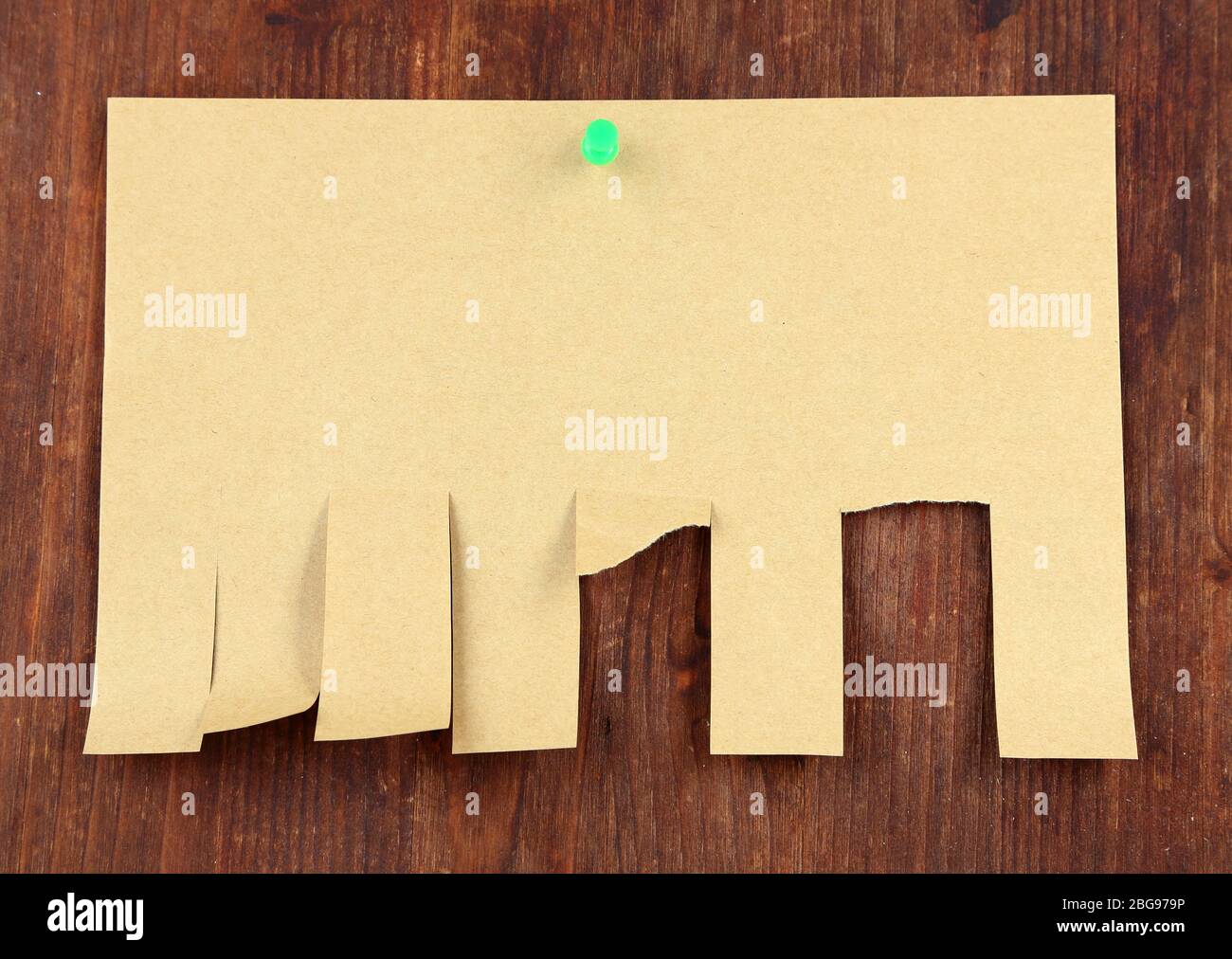 Paper ads on wooden background Stock Photo - Alamy