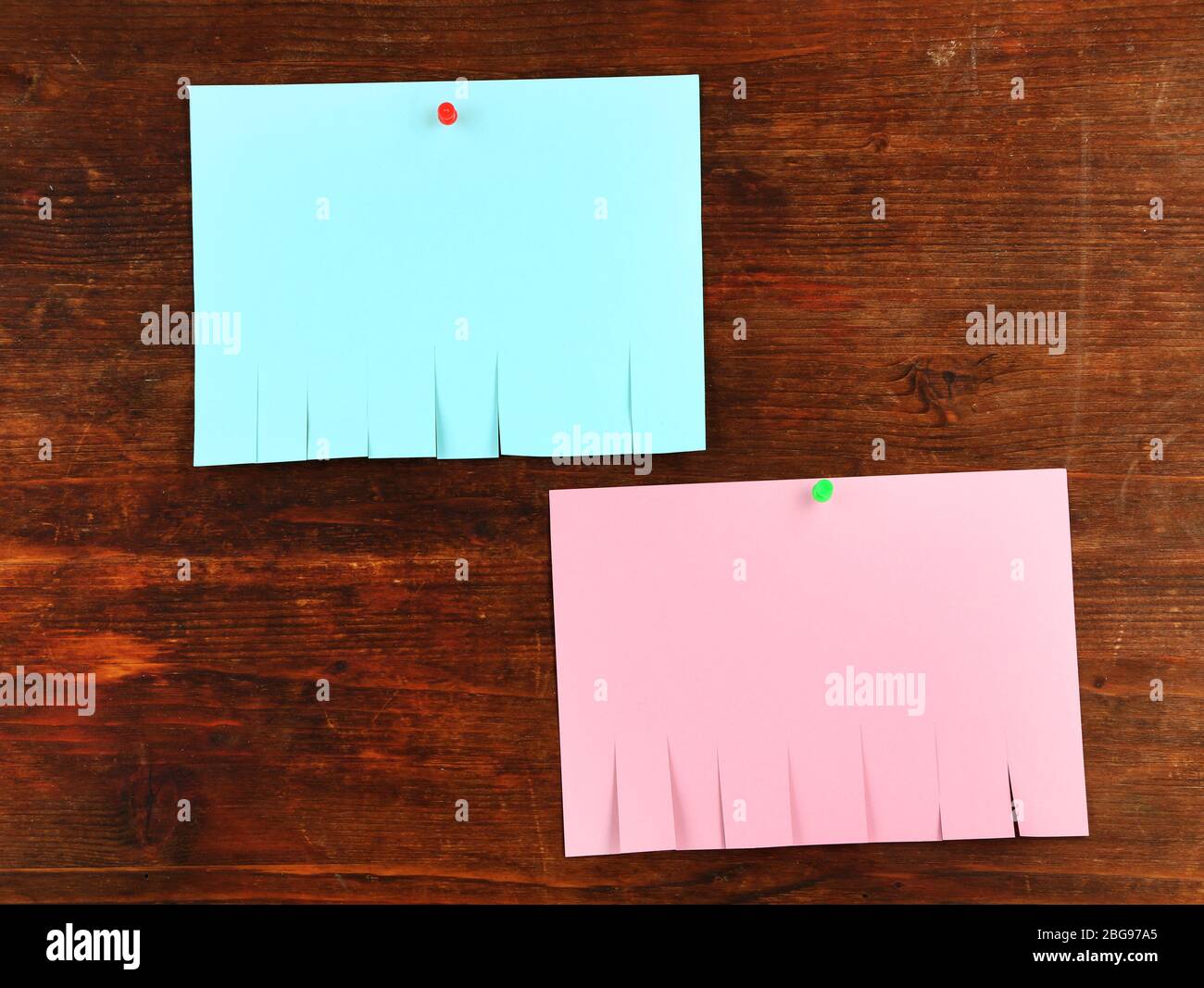 Paper ads on wooden background Stock Photo - Alamy