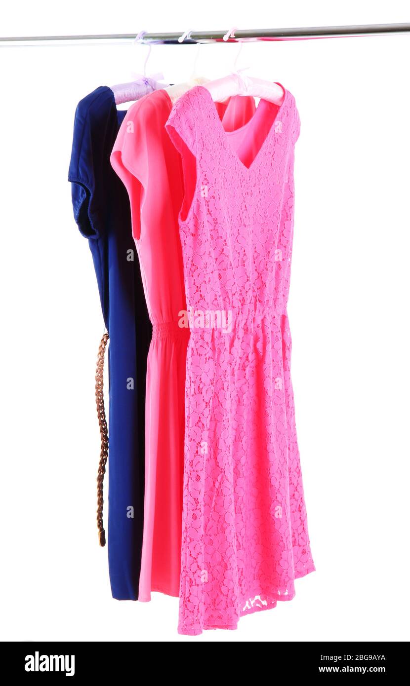 Beautiful dresses hanging on hangers isolated on white Stock Photo - Alamy