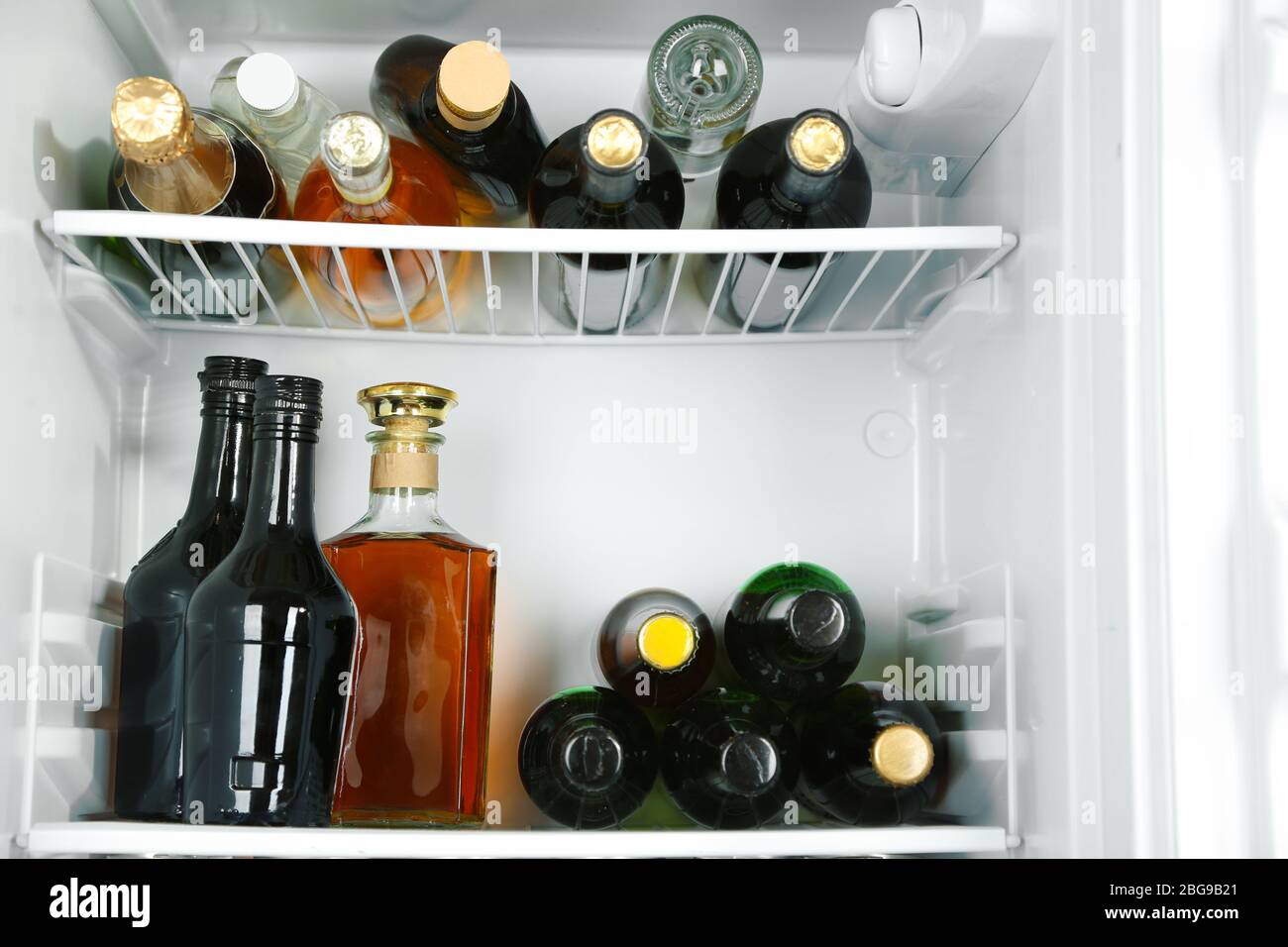Refrigerator full of bottles with alcoholic drinks Stock Photo - Alamy