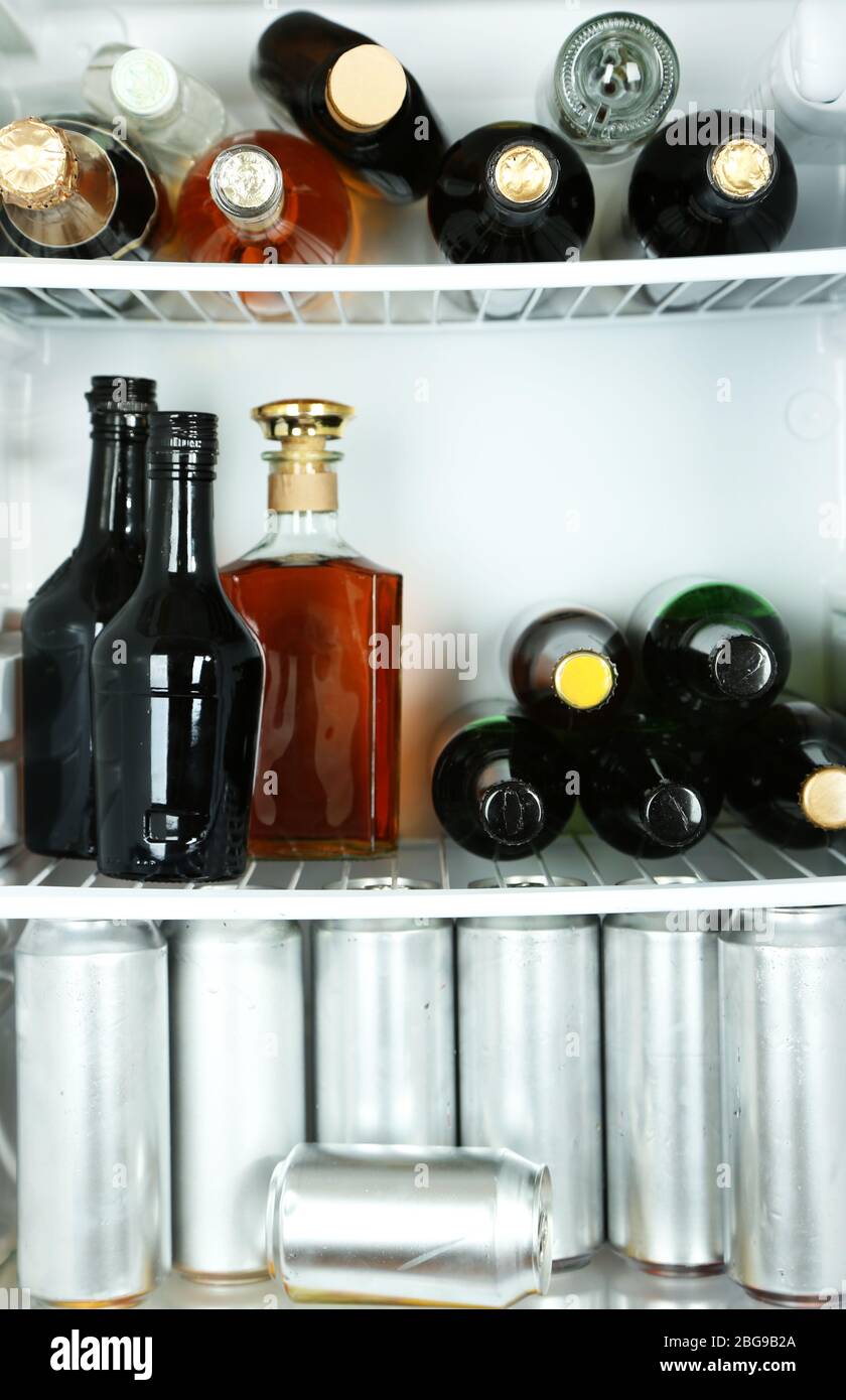 Refrigerator full of bottles with alcoholic drinks Stock Photo - Alamy