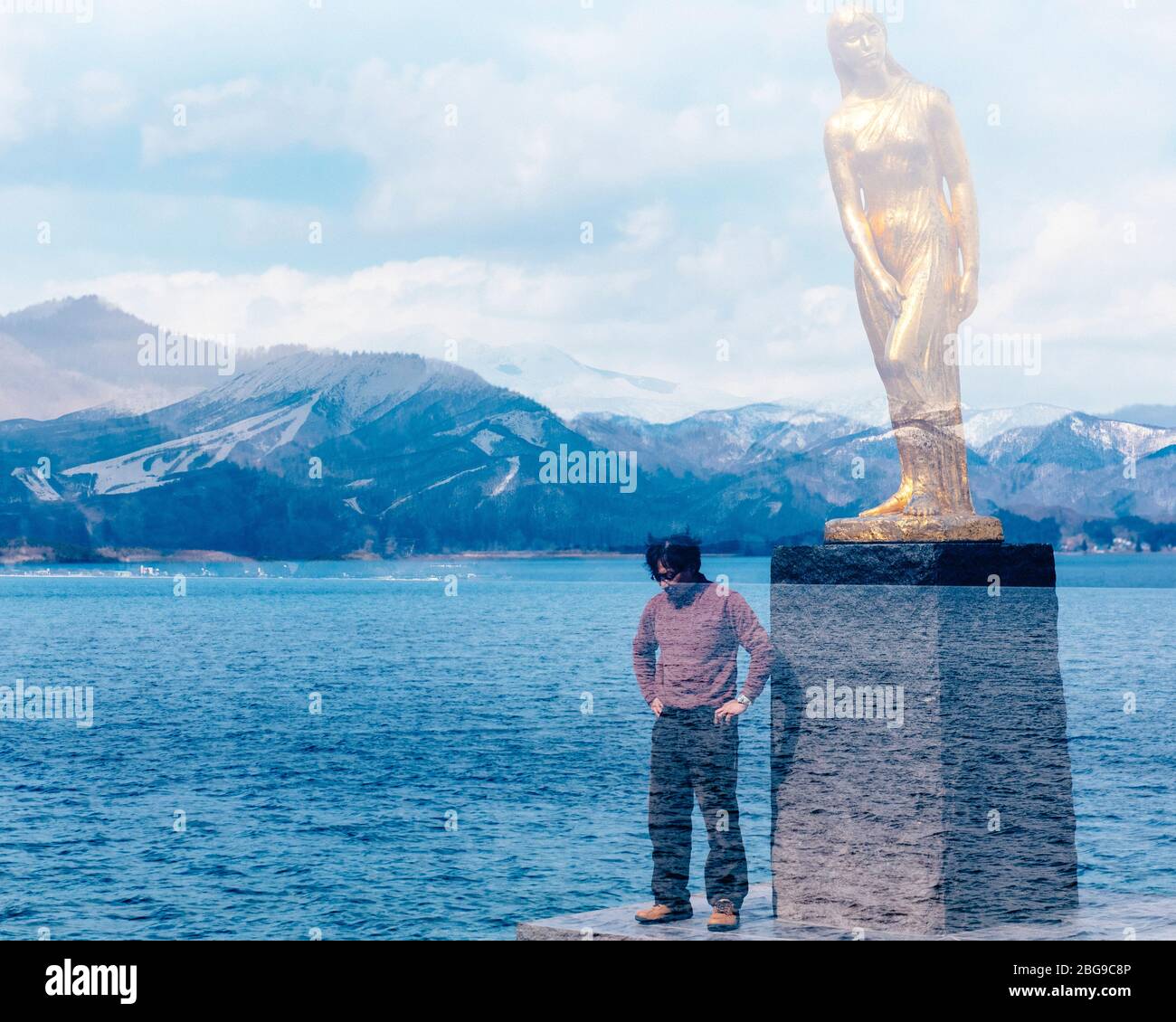 Double exposure photo of Tatsuko golden statue at Lake Tazawa, Akita ...