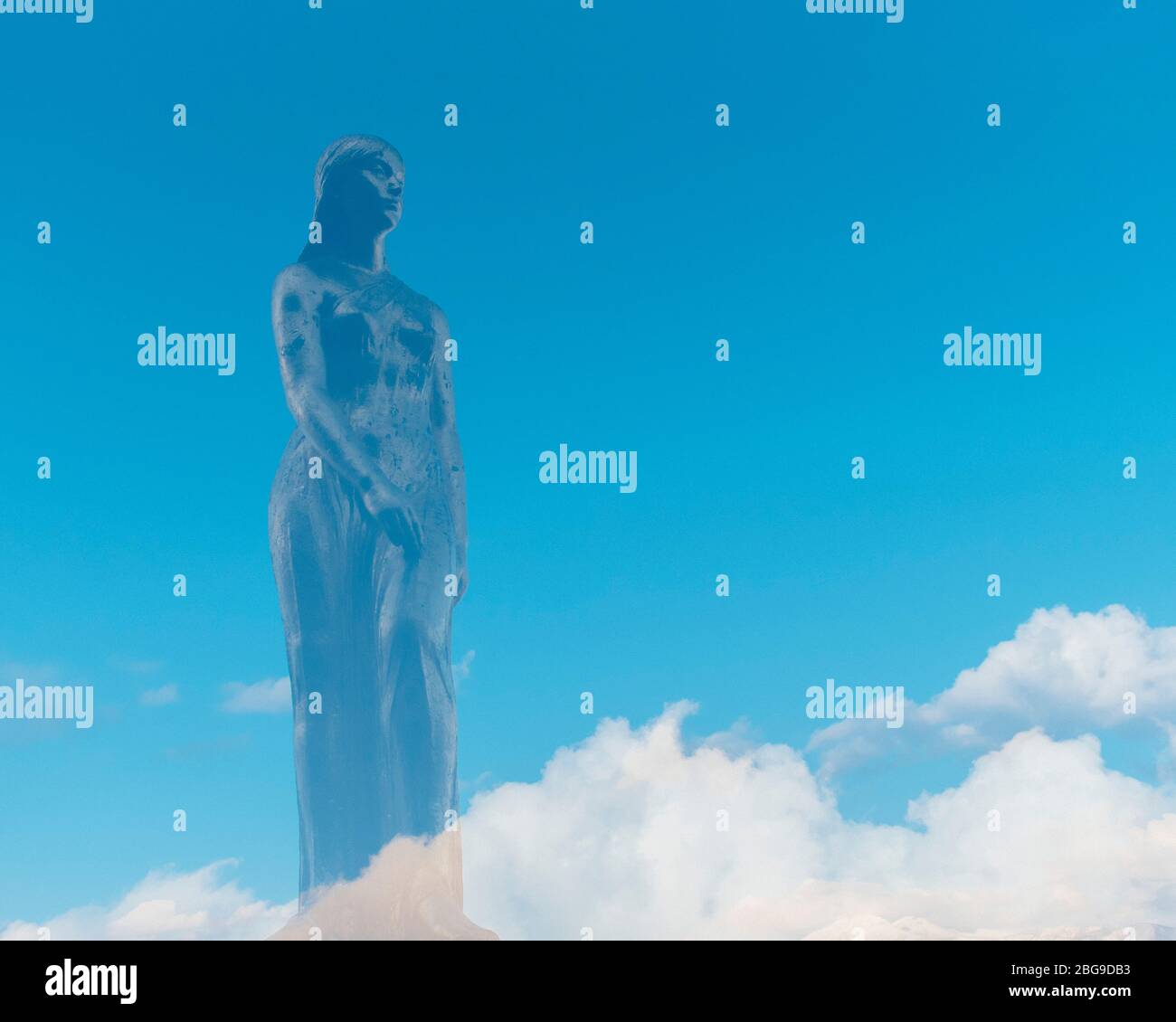 Double exposure photo of Tatsuko golden statue at Lake Tazawa, Akita ...