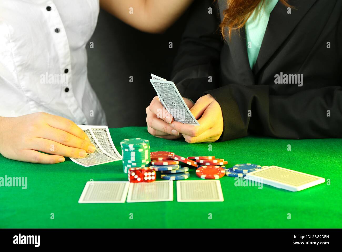 People playing cards at table Stock Photo - Alamy