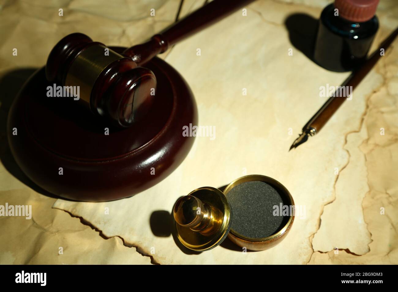 Wooden stamp, gavel and old papers, close up Stock Photo - Alamy