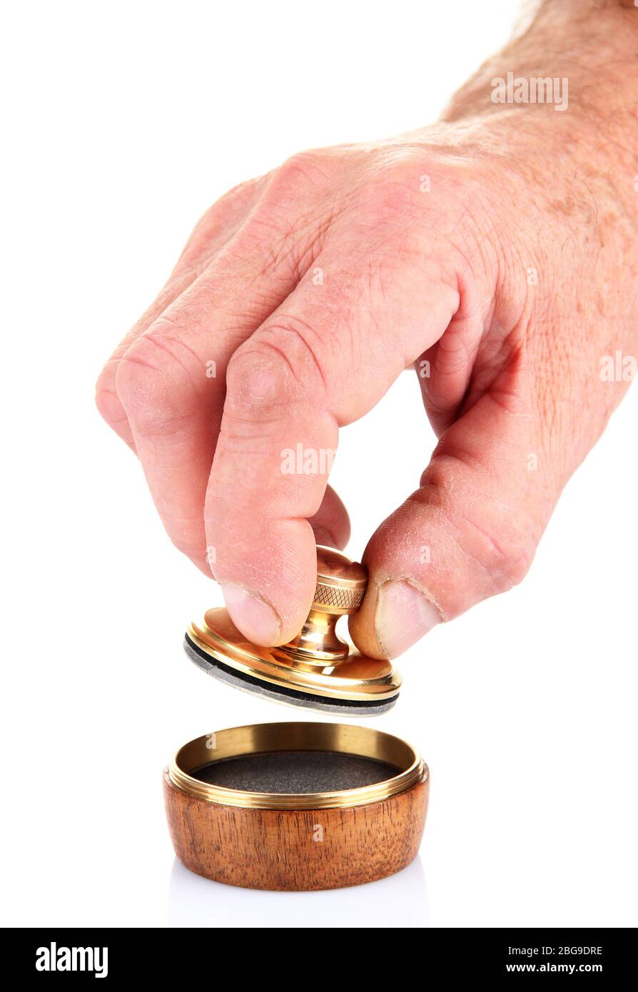 Hand with metal stamp, isolated on white Stock Photo - Alamy