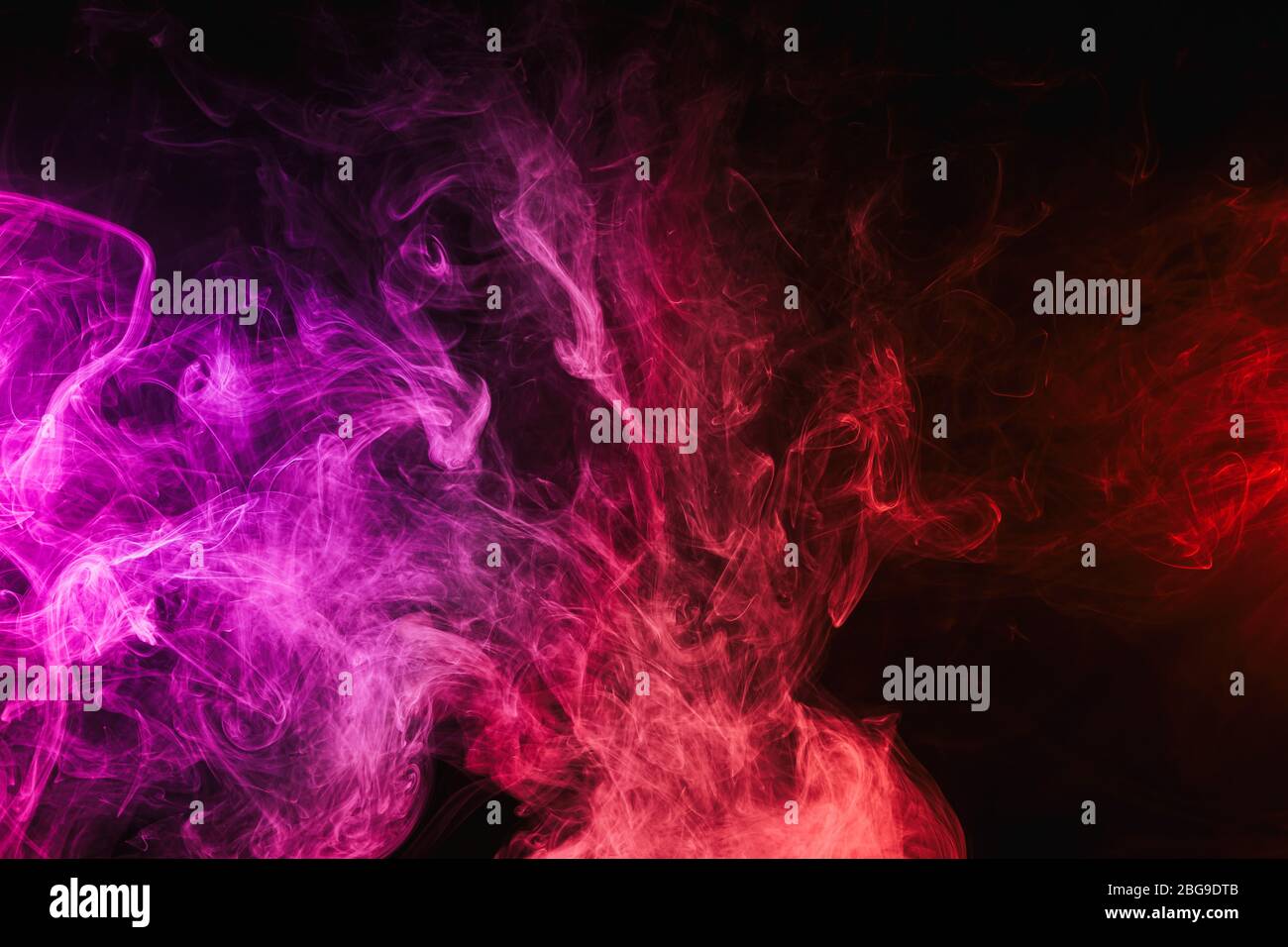 Smoke of pattern pink and red on a dark isolated background. Scary and ...