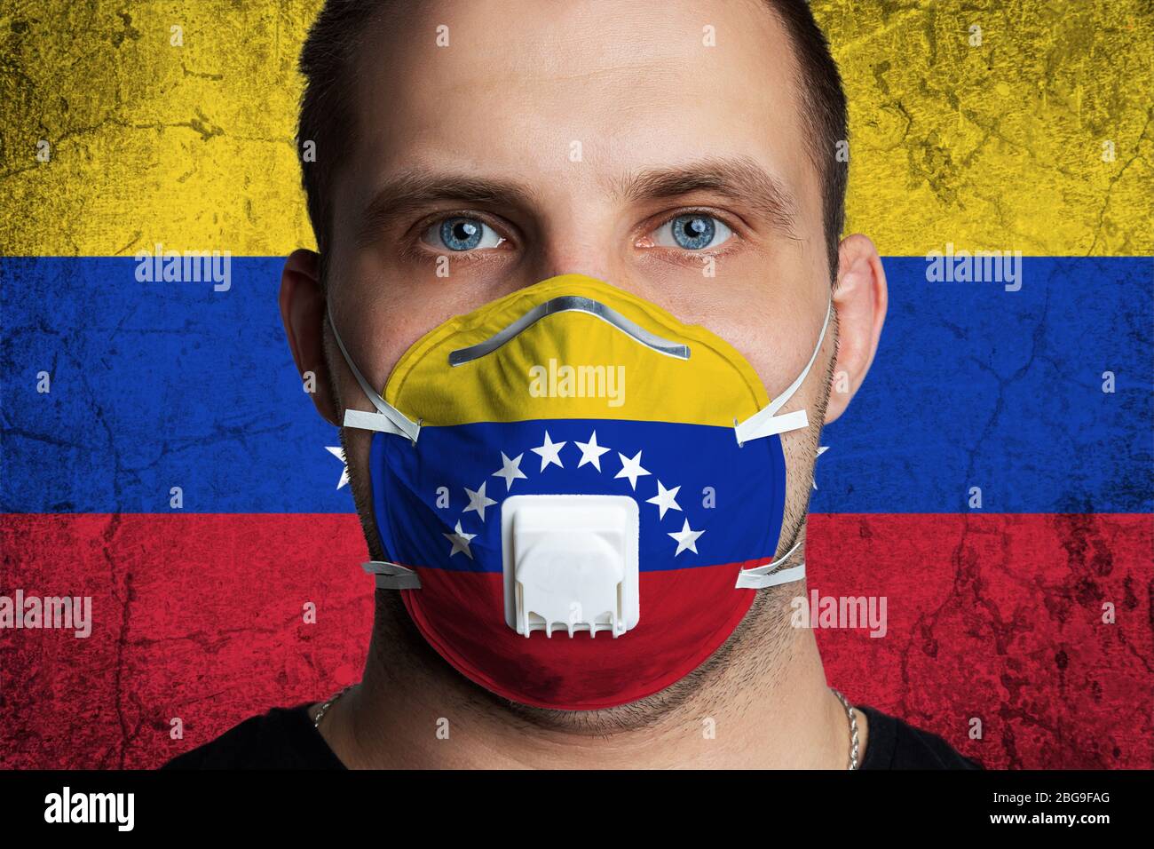 Young man with sore eyes in a medical mask painted in the colors of the ...