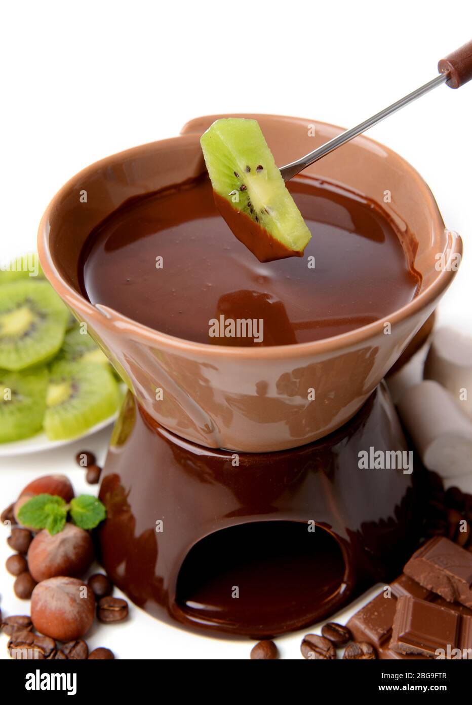 Chocolate fondue with fruits, isolated on white Stock Photo - Alamy