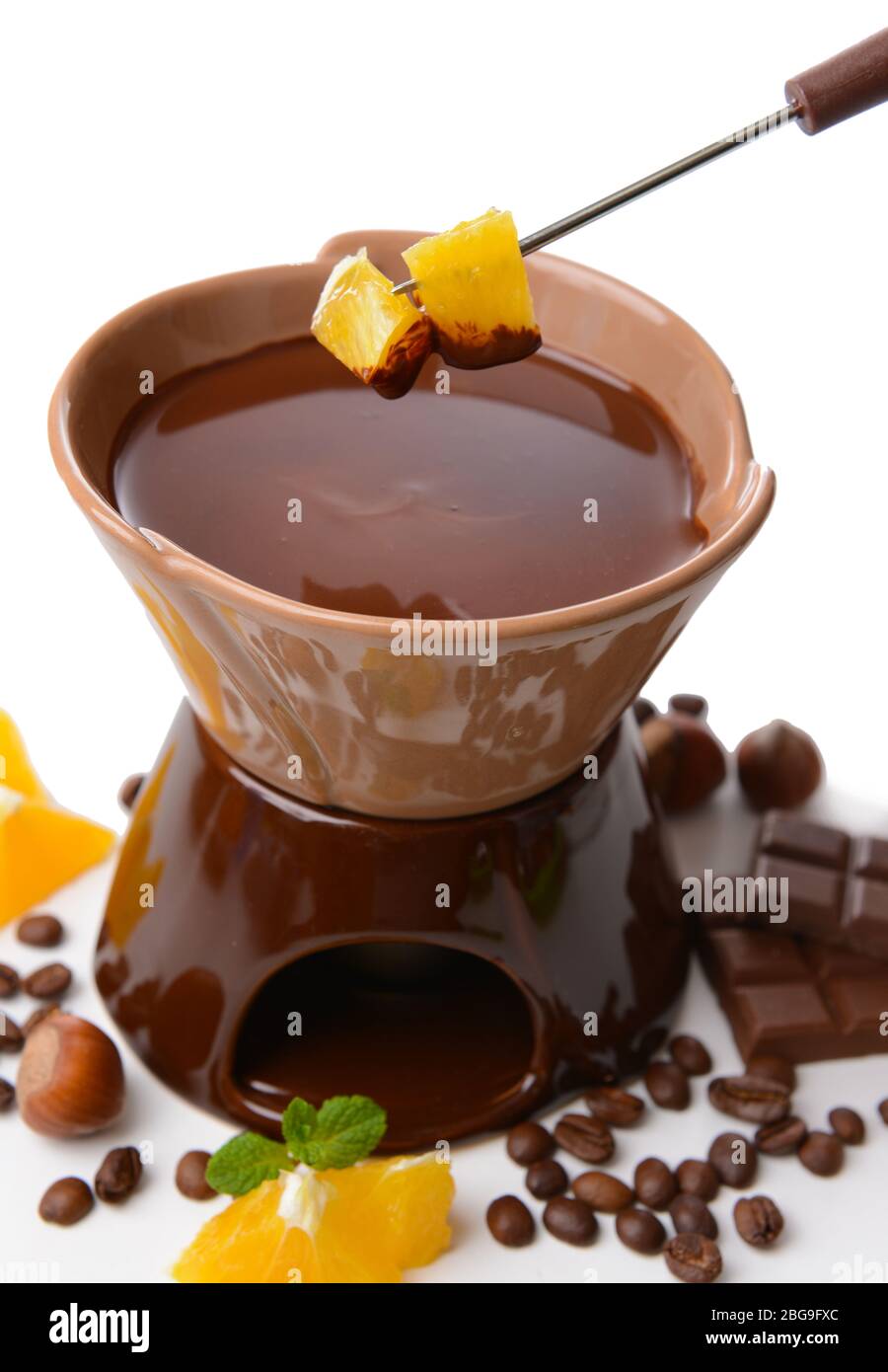 Chocolate fondue with fruits, isolated on white Stock Photo - Alamy