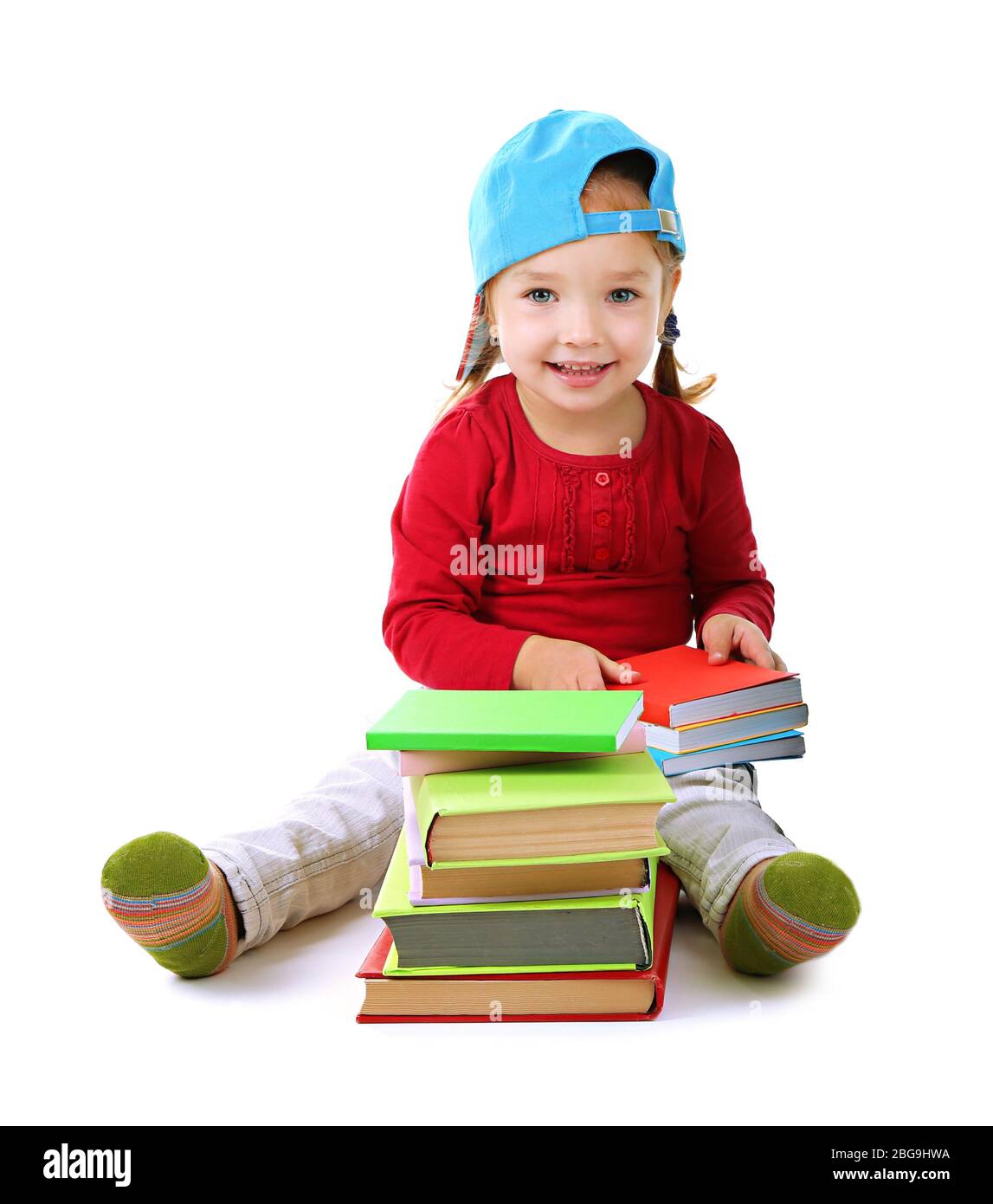 Little girl with books isolated on white Stock Photo - Alamy