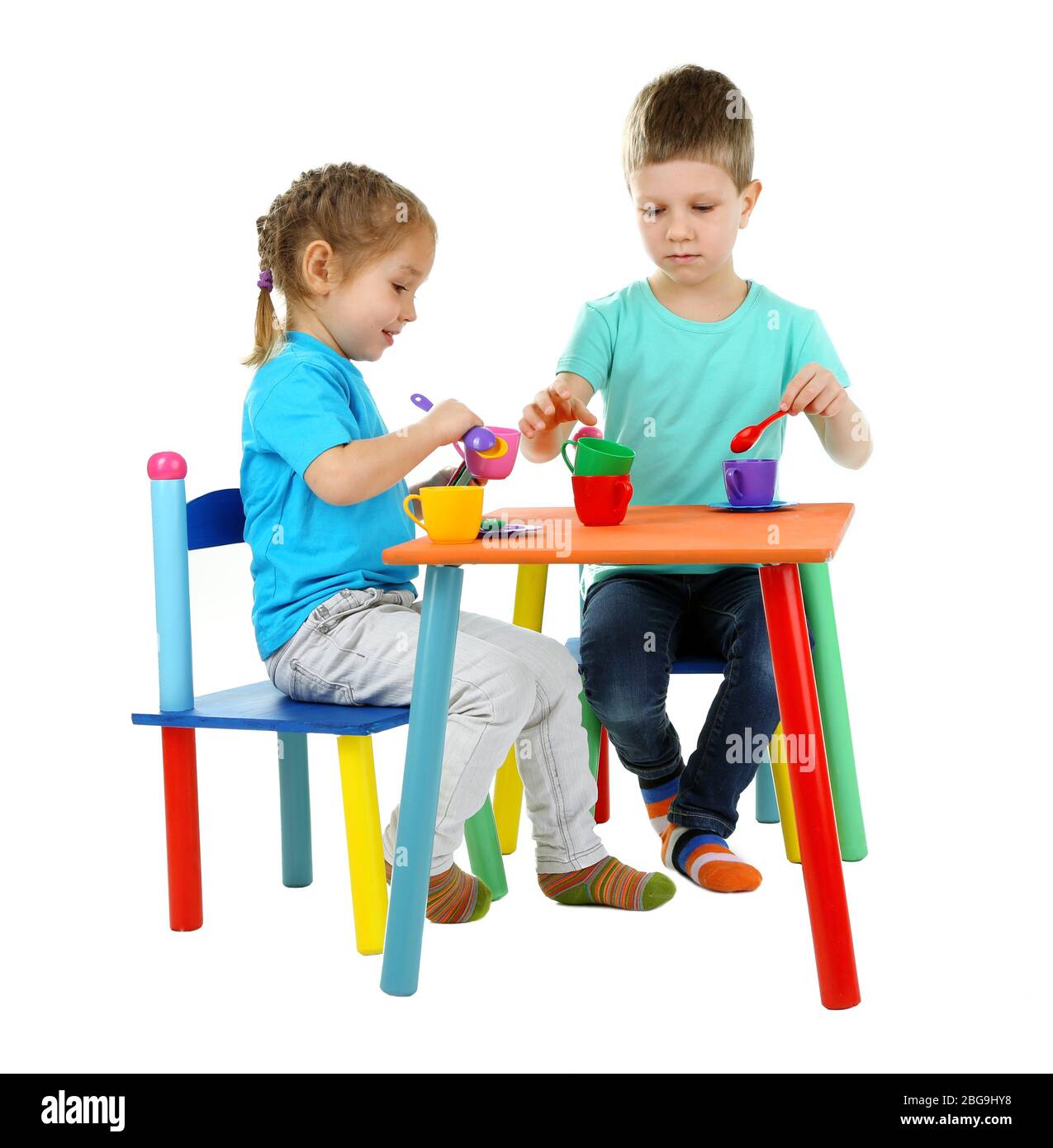 Little children playing with colorful tableware isolated on white Stock ...