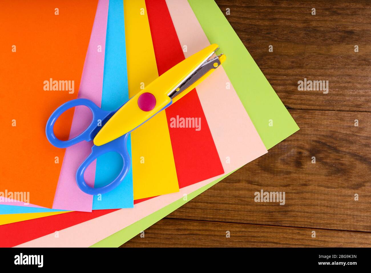 Colorful cardboard and scissors on table close-up Stock Photo - Alamy