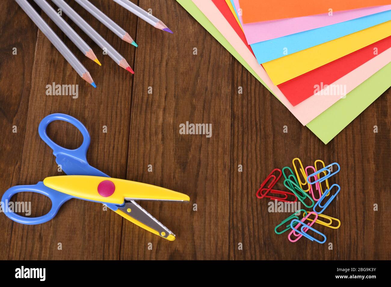 Colorful cardboard and scissors on table close-up Stock Photo - Alamy