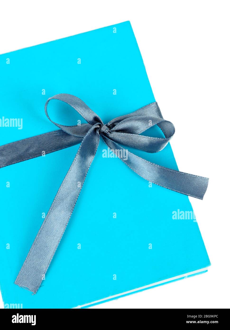 Book wrapped with color ribbon, isolated on white Stock Photo - Alamy