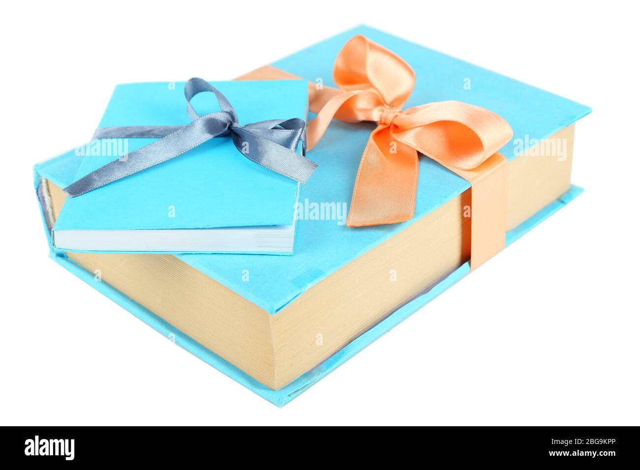 Books wrapped with color ribbons, isolated on white Stock Photo - Alamy