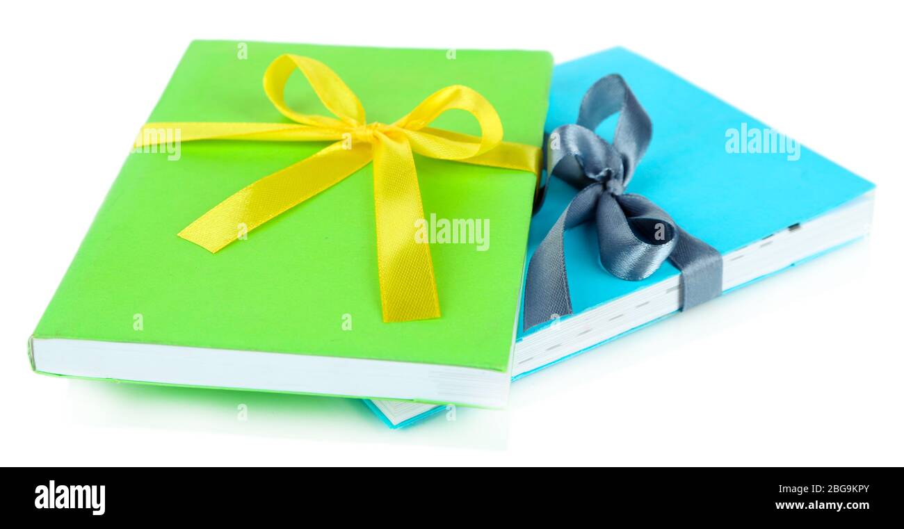 Books wrapped with color ribbons, isolated on white Stock Photo - Alamy