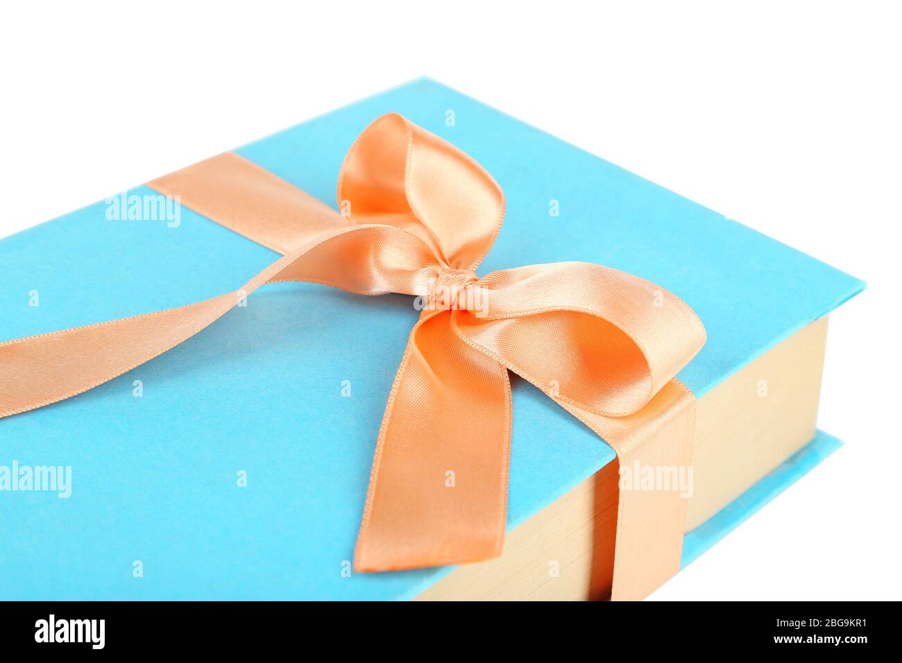 Book wrapped with color ribbon, isolated on white Stock Photo - Alamy