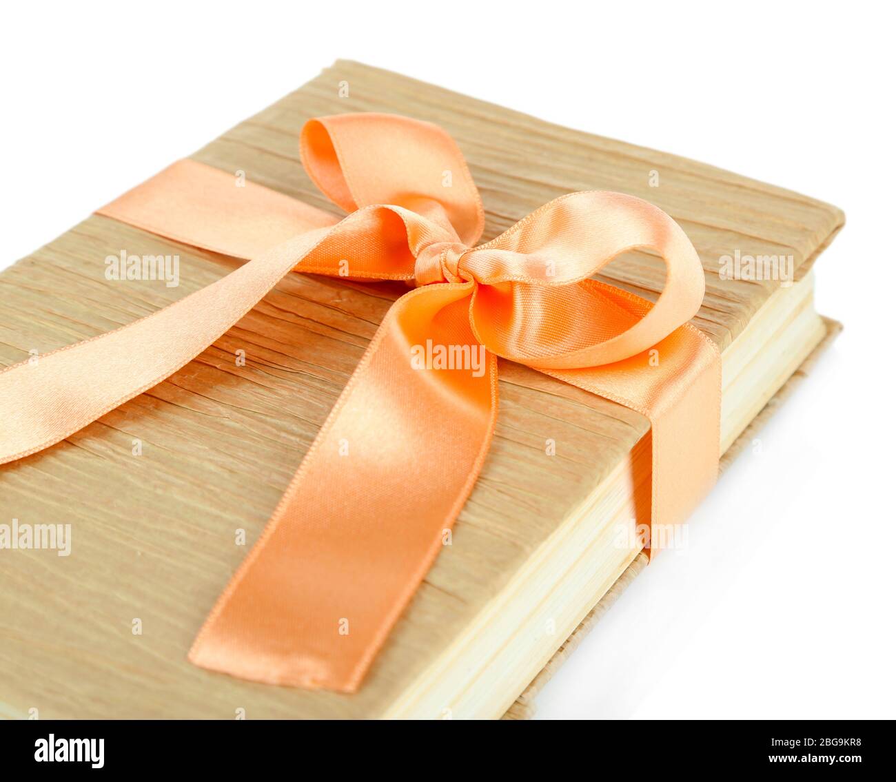 Book wrapped with color ribbon, isolated on white Stock Photo - Alamy