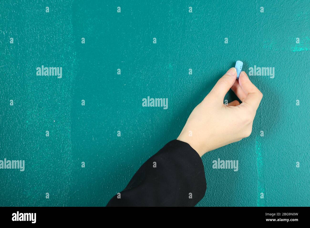 Hand writing on blackboard in class room Stock Photo - Alamy