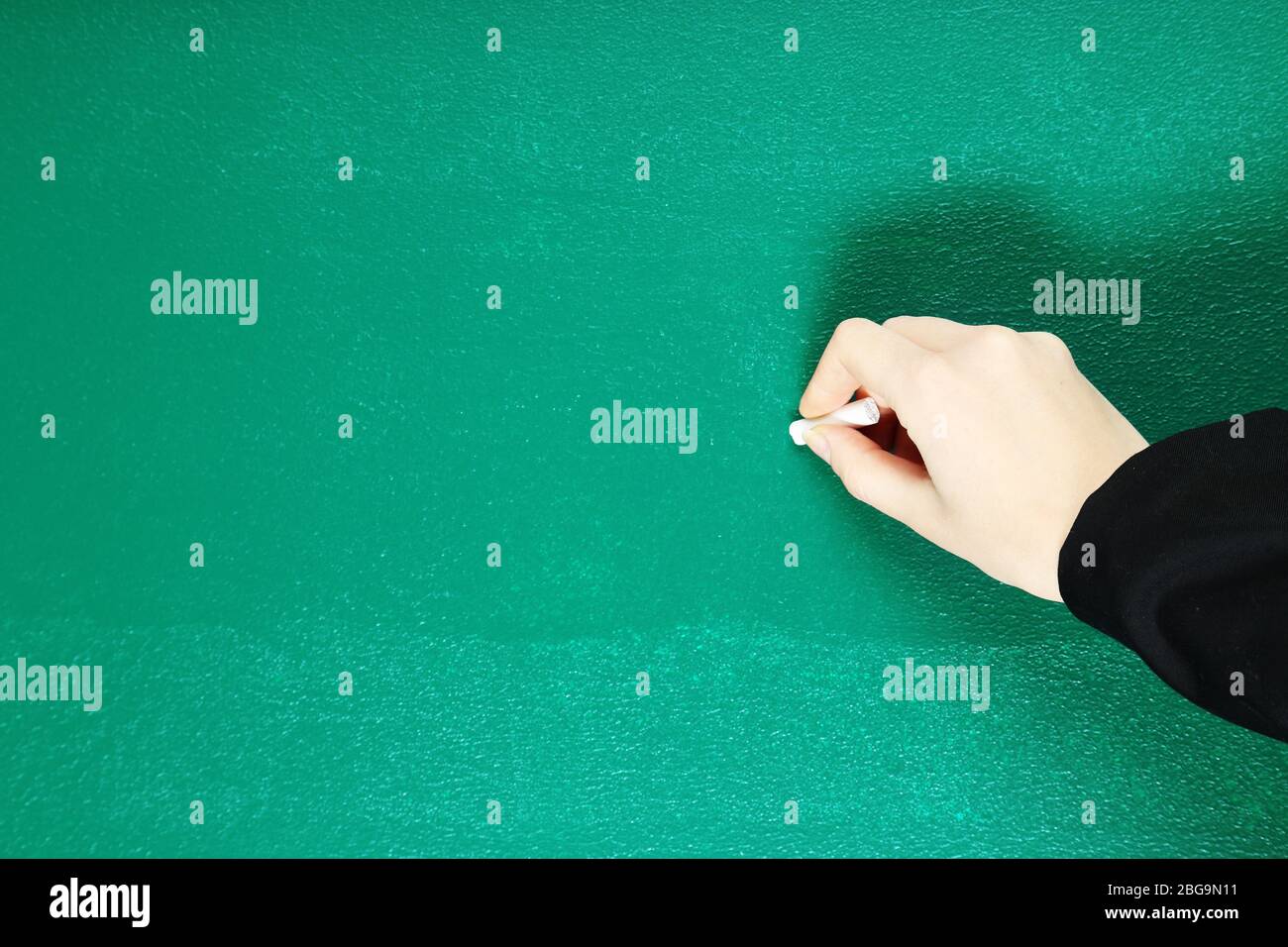 Hand writing on blackboard in class room Stock Photo - Alamy