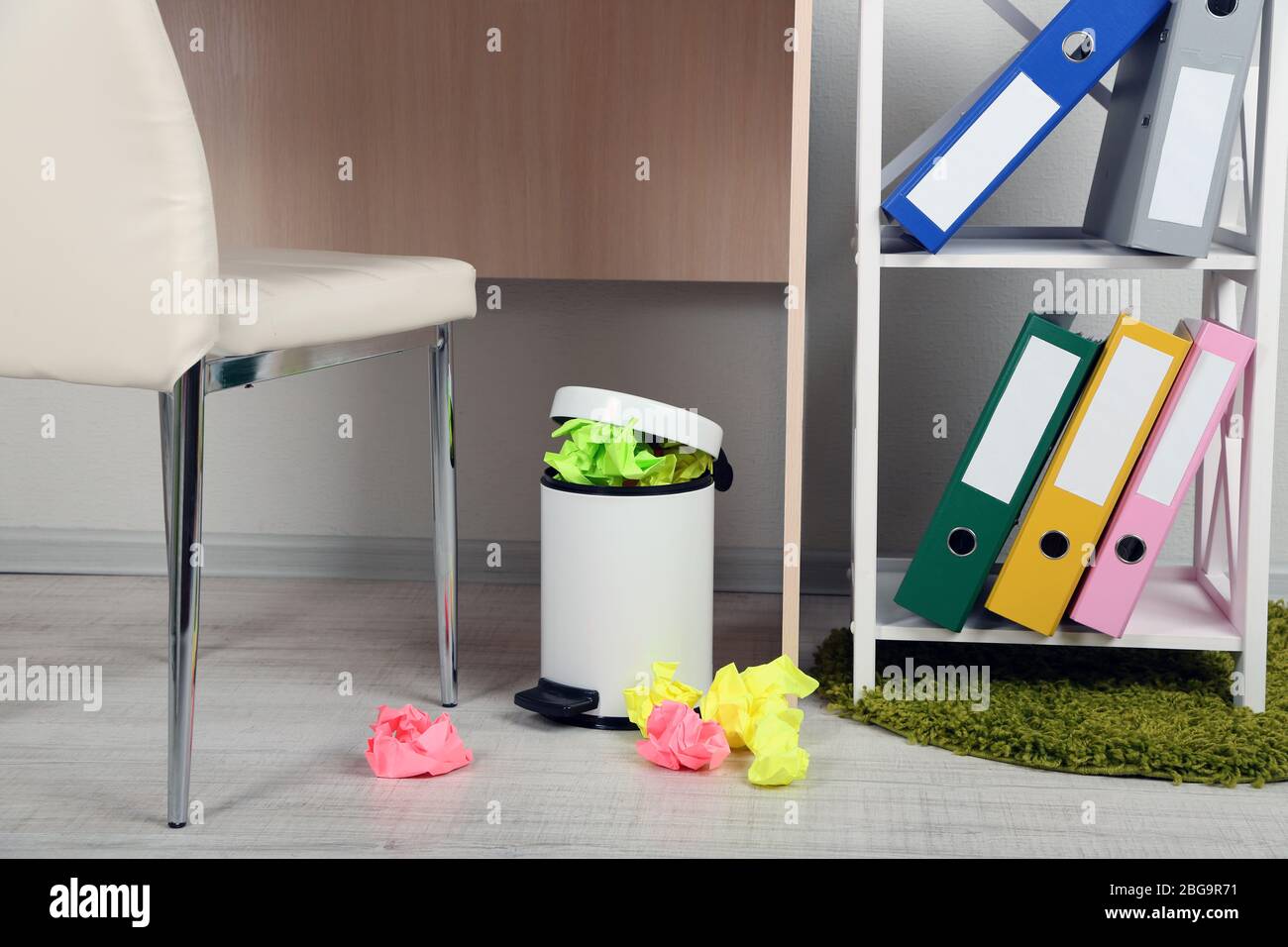 Garbage bin, on office background Stock Photo - Alamy