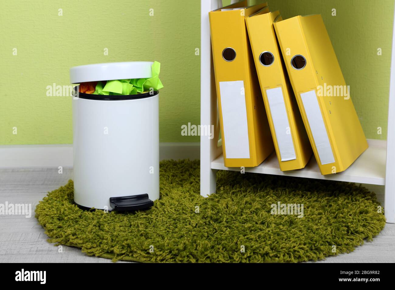 Garbage bin, on office background Stock Photo - Alamy