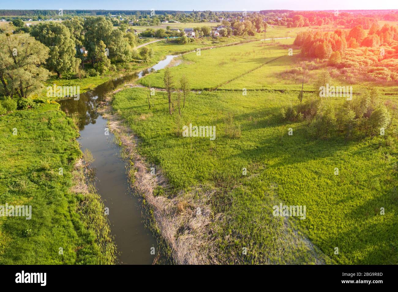 Aerial view of the countryside on a spring sunny day. Brook on the ...