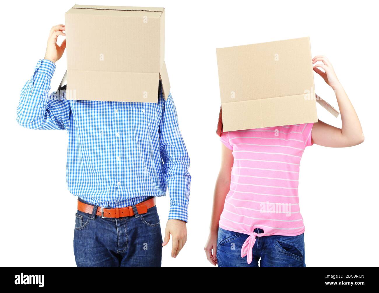 Couple with cardboard boxes on their heads isolated on white Stock ...